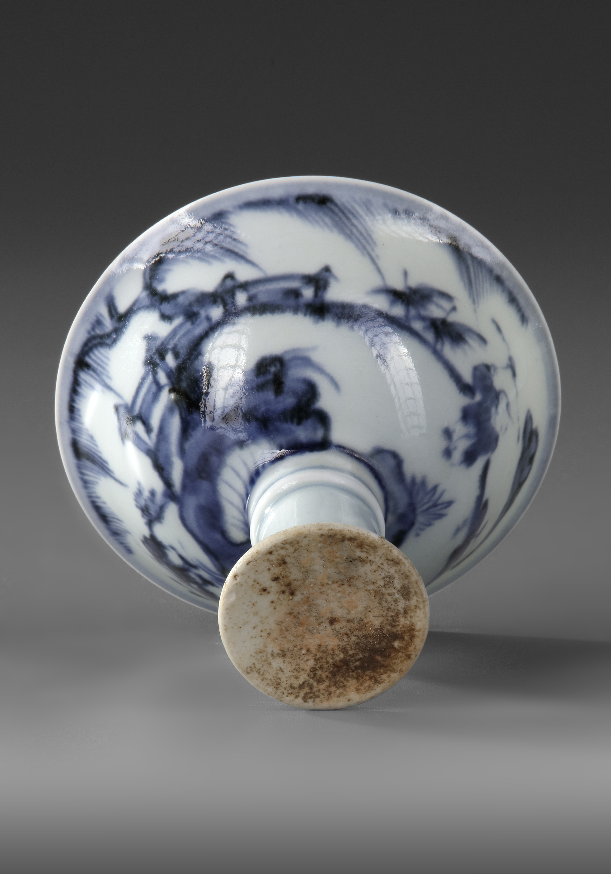 A CHINESE BLUE AND WHITE BOYS STEM CUP