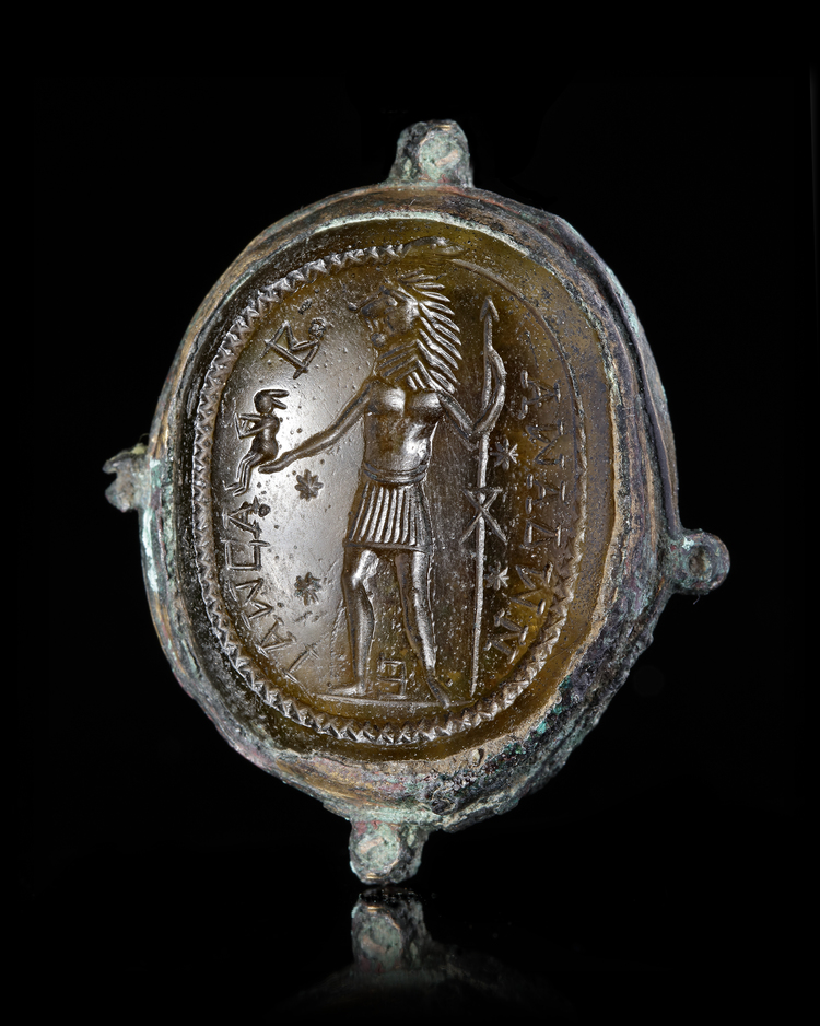 A ROMAN GNOSTIC INTAGLIO IN BRONZE MOUNT, 3RD CENTURY AD