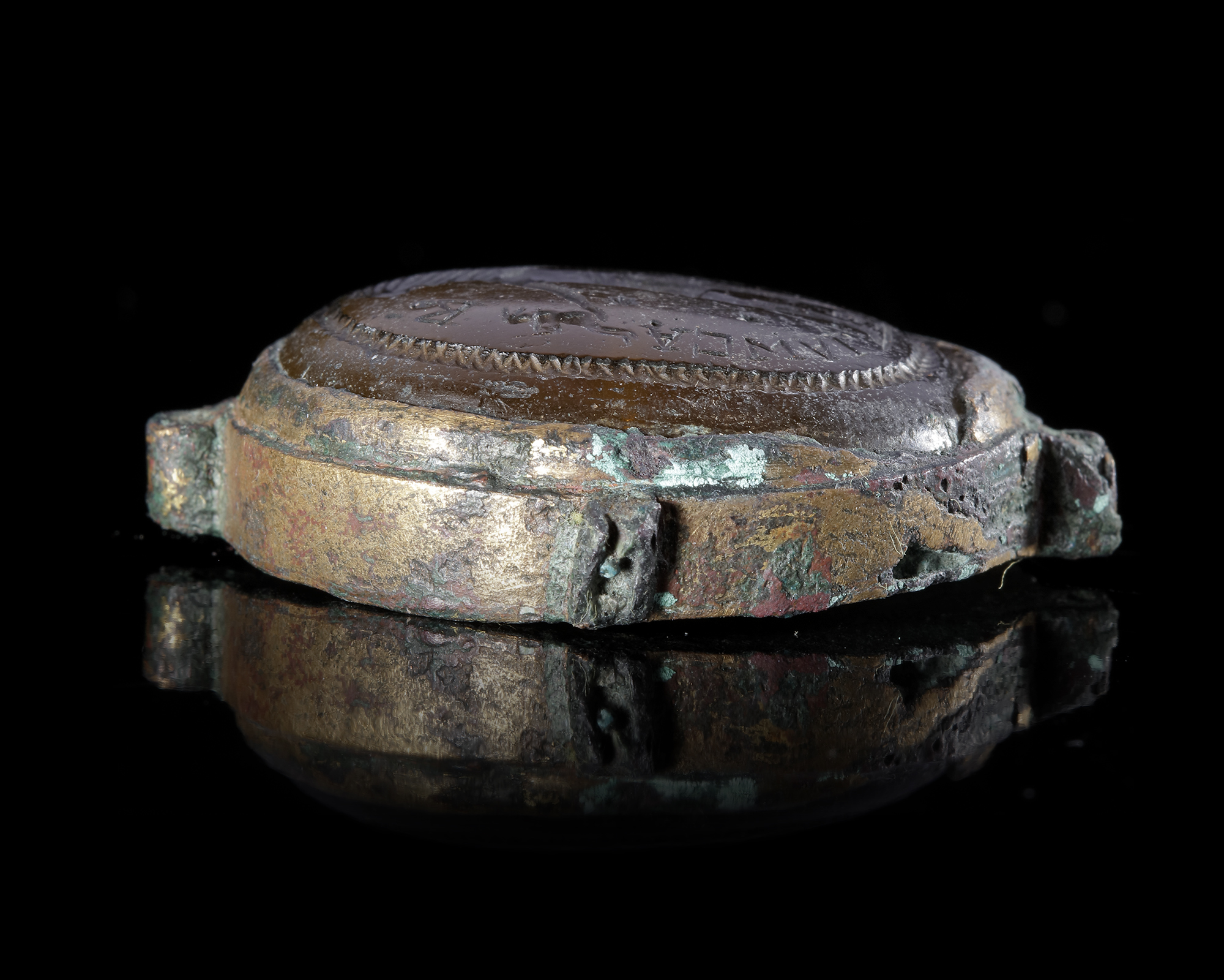 A ROMAN GNOSTIC INTAGLIO IN BRONZE MOUNT, 3RD CENTURY AD