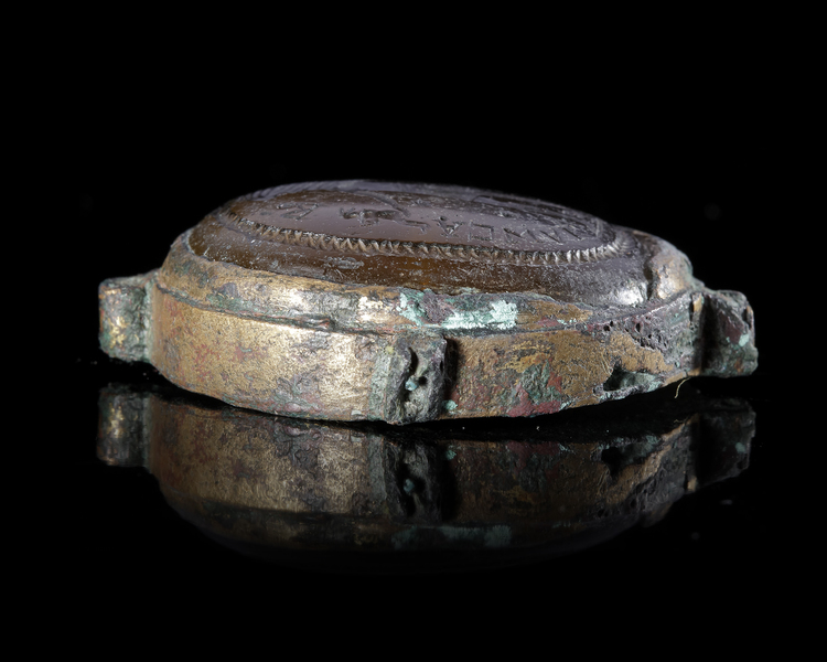 A ROMAN GNOSTIC INTAGLIO IN BRONZE MOUNT, 3RD CENTURY AD