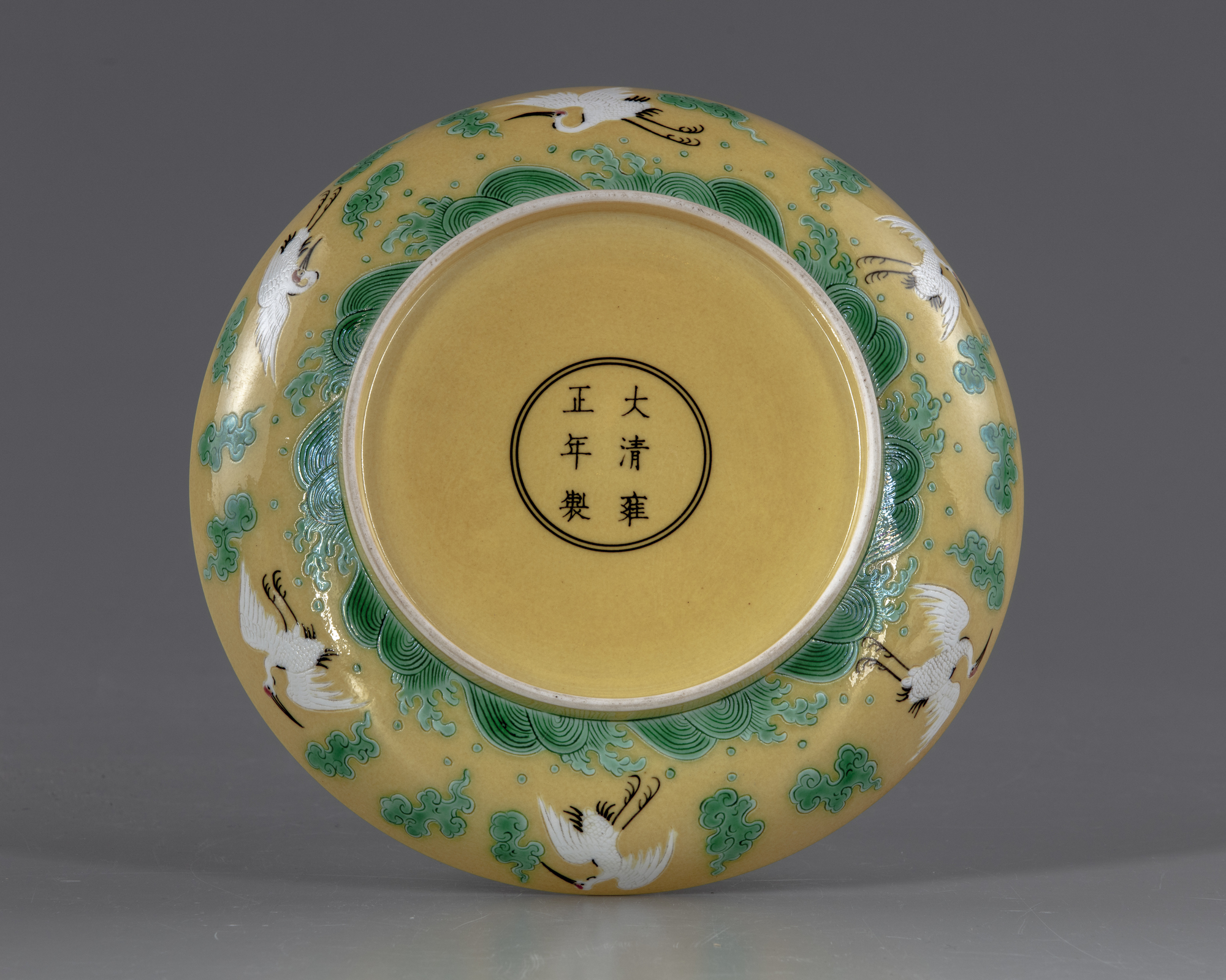 A CHINESE CRANES YELLOW DISH, 20TH CENTURY