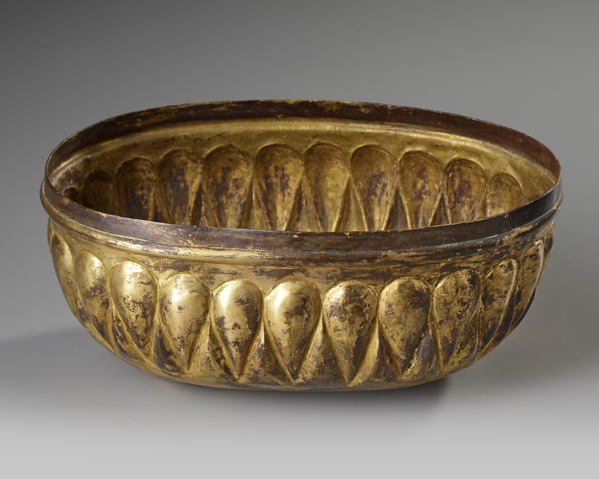 AN OTTOMAN GILT-COPPER (TOMBAK) HAMMAM BOWL, 18TH CENTURY
