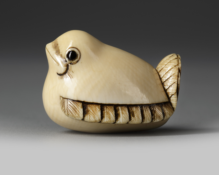 A JAPANESE IVORY NETSUKE OF THE SHAPE OF A SPARROW, SECOND HALF 19TH ...