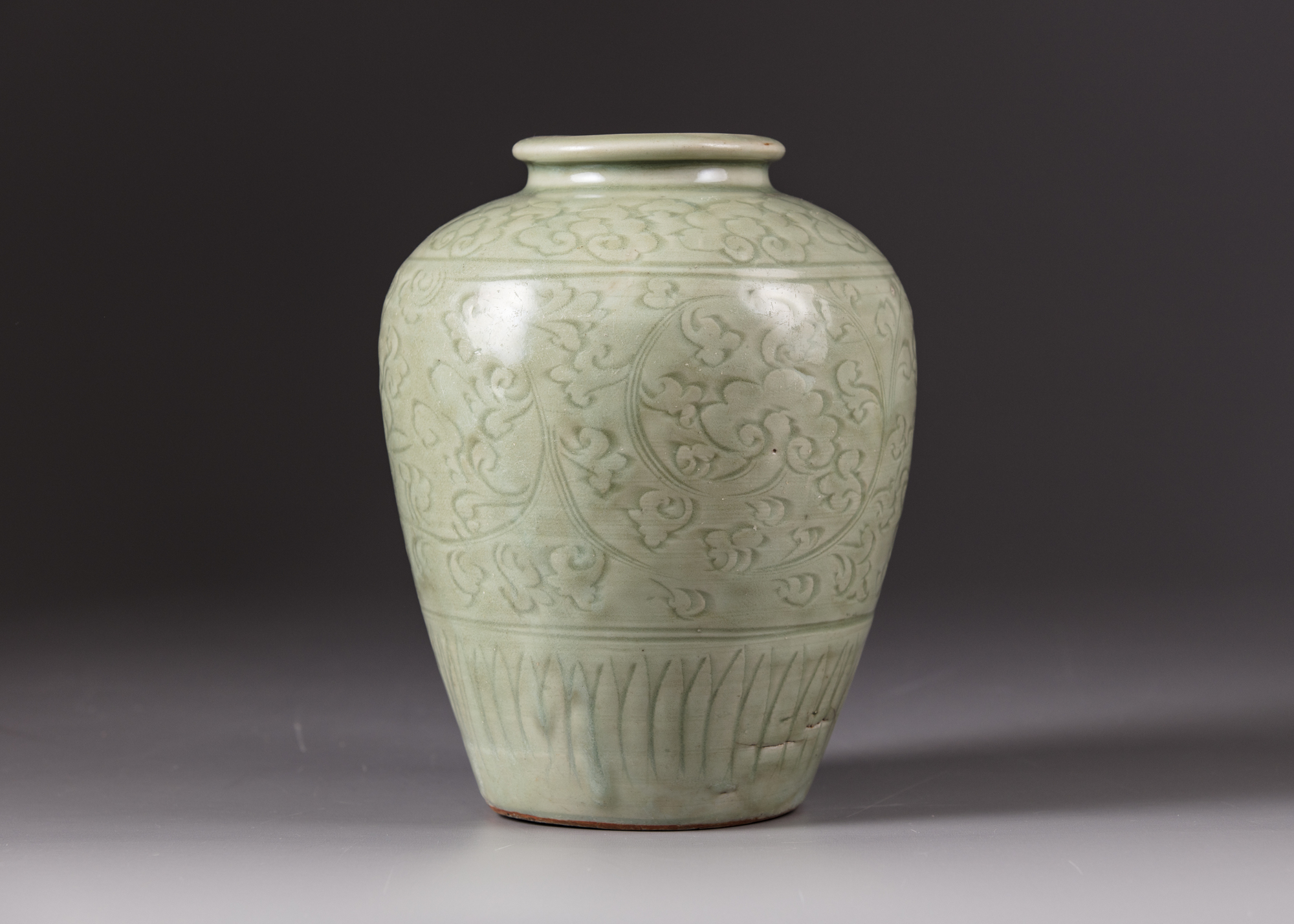 A celadon-glazed pot