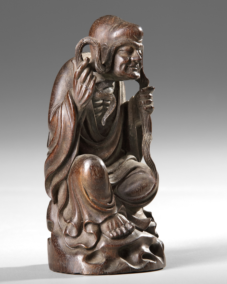 A CHINESE WOOD CARVING OF A LOHAN, 20TH CENTURY