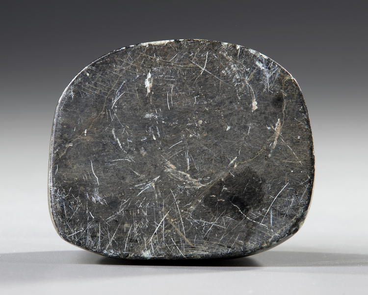 A GREEN ALABASTER PLANK IDOL, 2ND MILLENNIUM BC