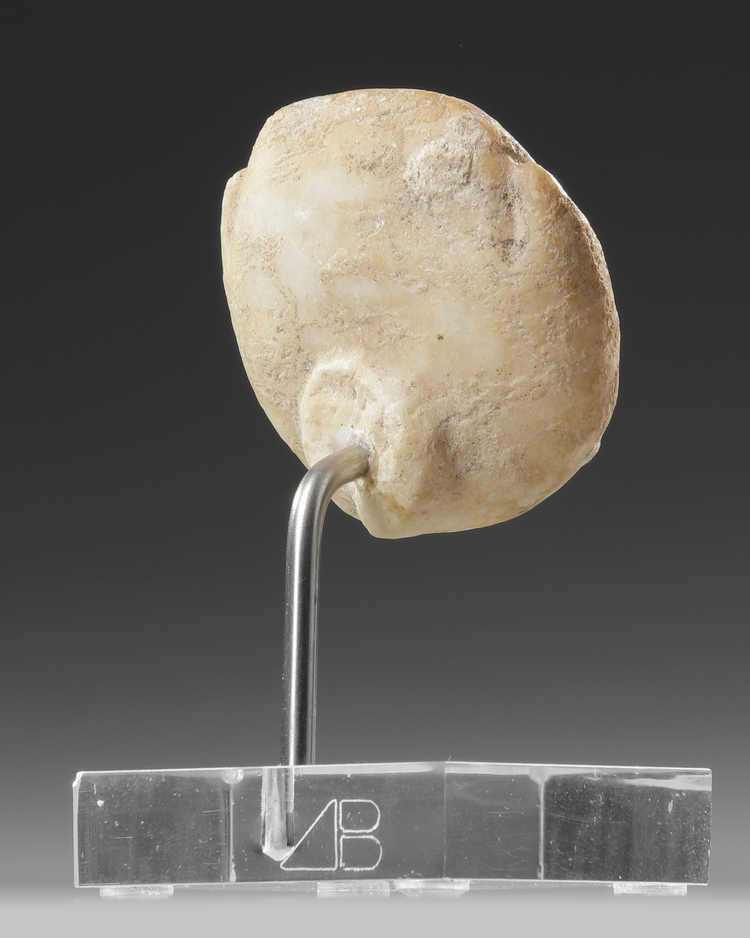 A HEAD OF A MARBLE IDOL, KILIYA TYPE, WESTERN ASIATIC, CIRCA 2700-2400/ ...