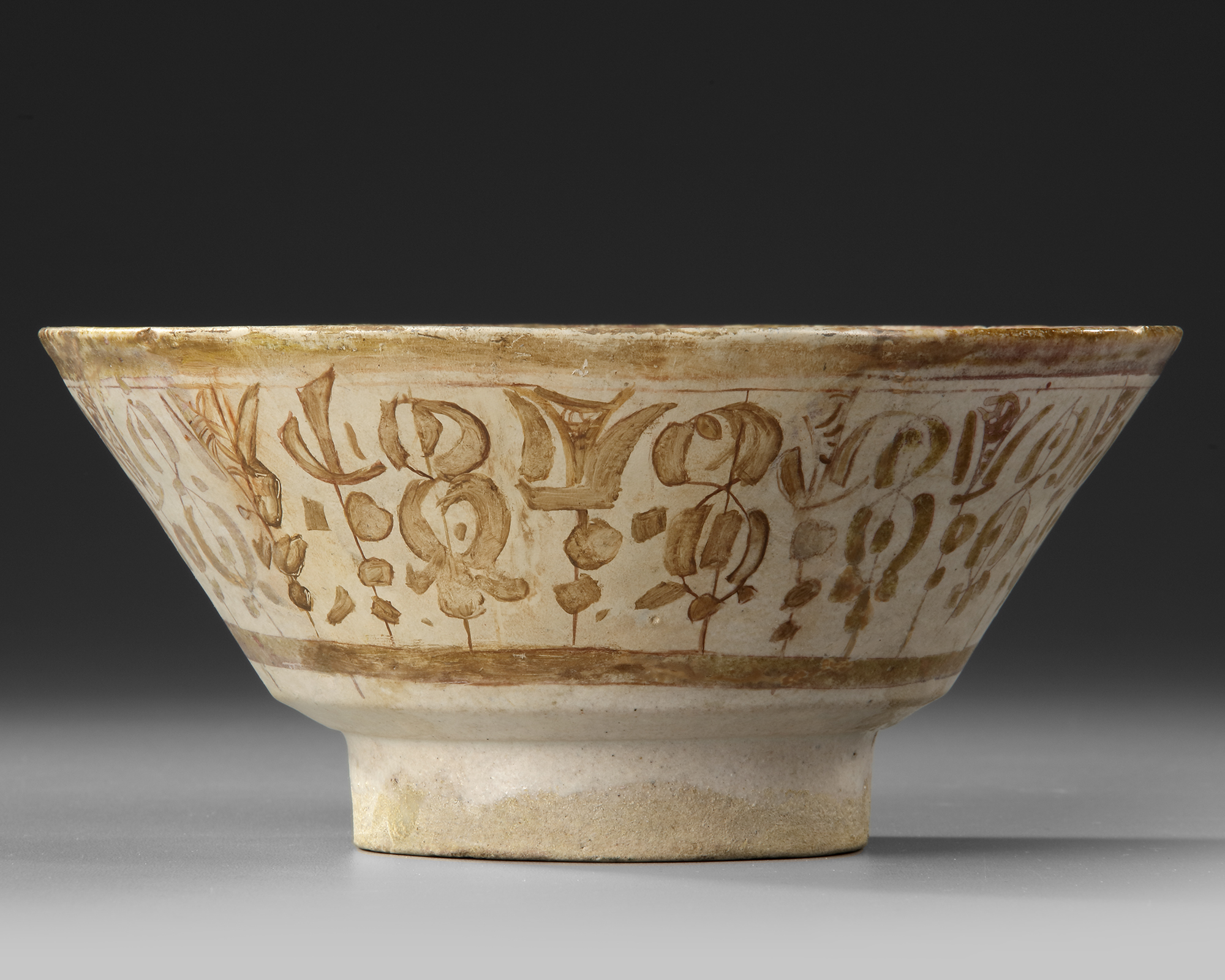 A KASHAN POTTERY BOWL, CENTRAL PERSIA, 12TH-13TH CENTURY