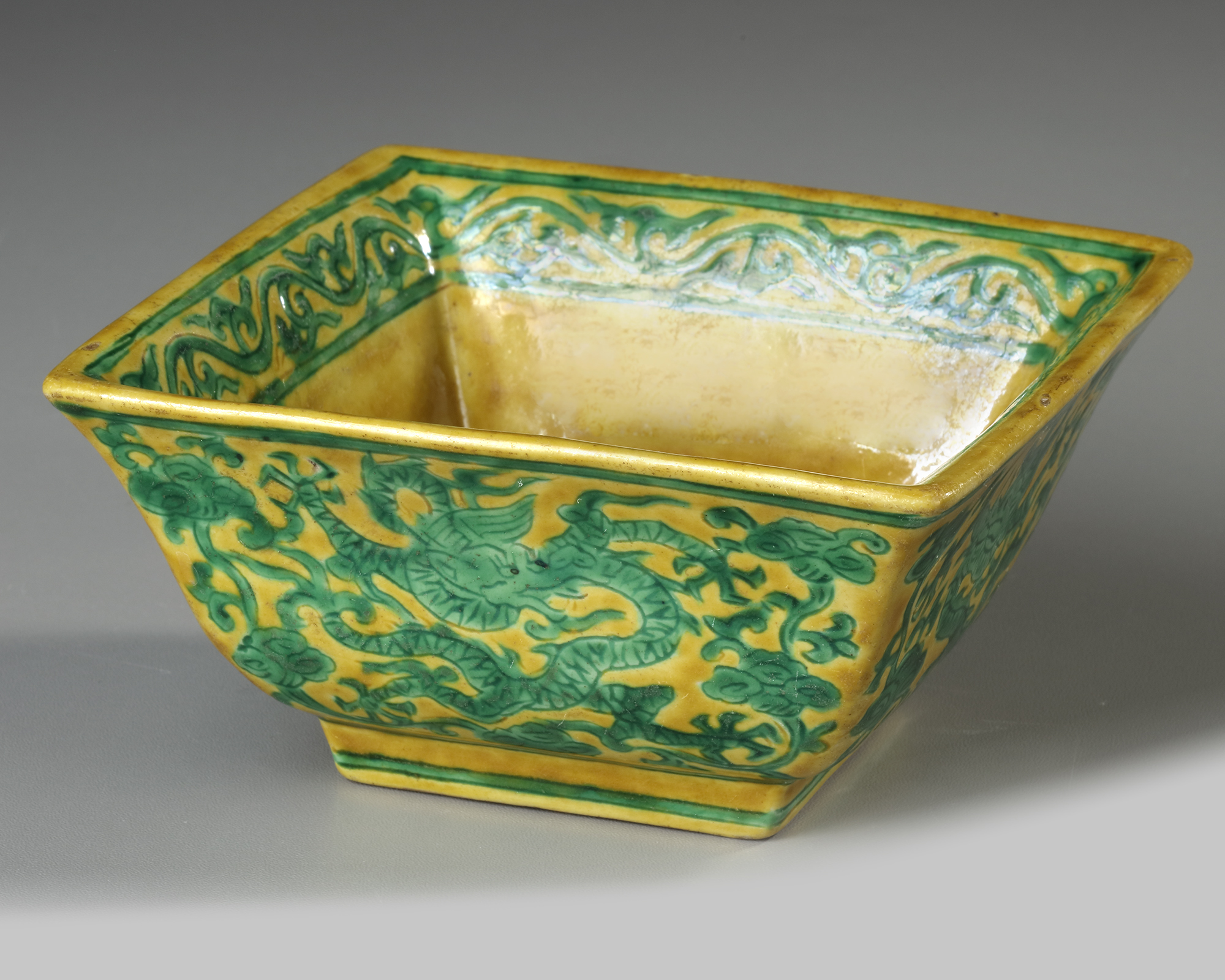A POLYCHROME YELLOW AND GREEN DRAGON SQUARE BOWL, MING DYNASTY (1368 ...