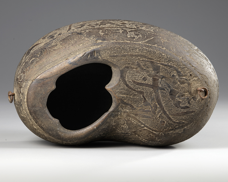 A LARGE QAJAR WOODEN BEGGAR'S BOWL (KASHKUL), 19TH CENTURY