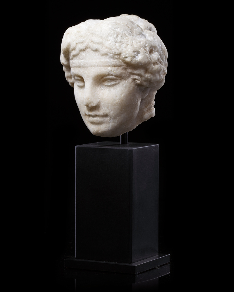 A HEAD OF APOLLO, MARBLE, GREEK, EARLY 4TH CENTURY BC