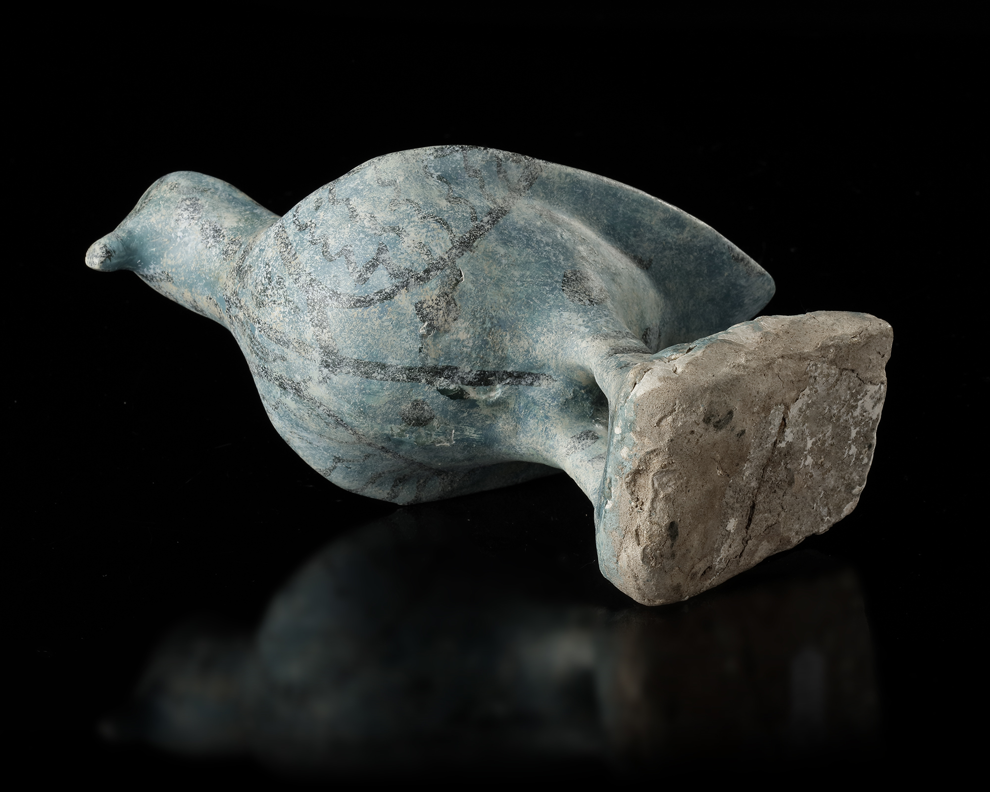 AN ISLAMIC TURQUOISE GLAZED FIGURE OF A BIRD, 13TH CENTURY