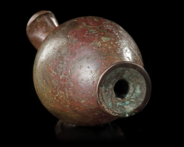 A ROMAN BEAKED JUG WITH FIGURAL HANDLE, CIRCA 1ST CENTURY AD