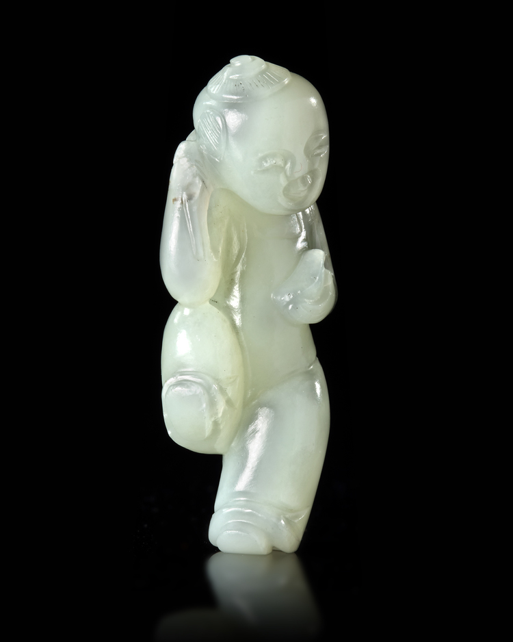 A CHINESE JADE CARVED FIGURE