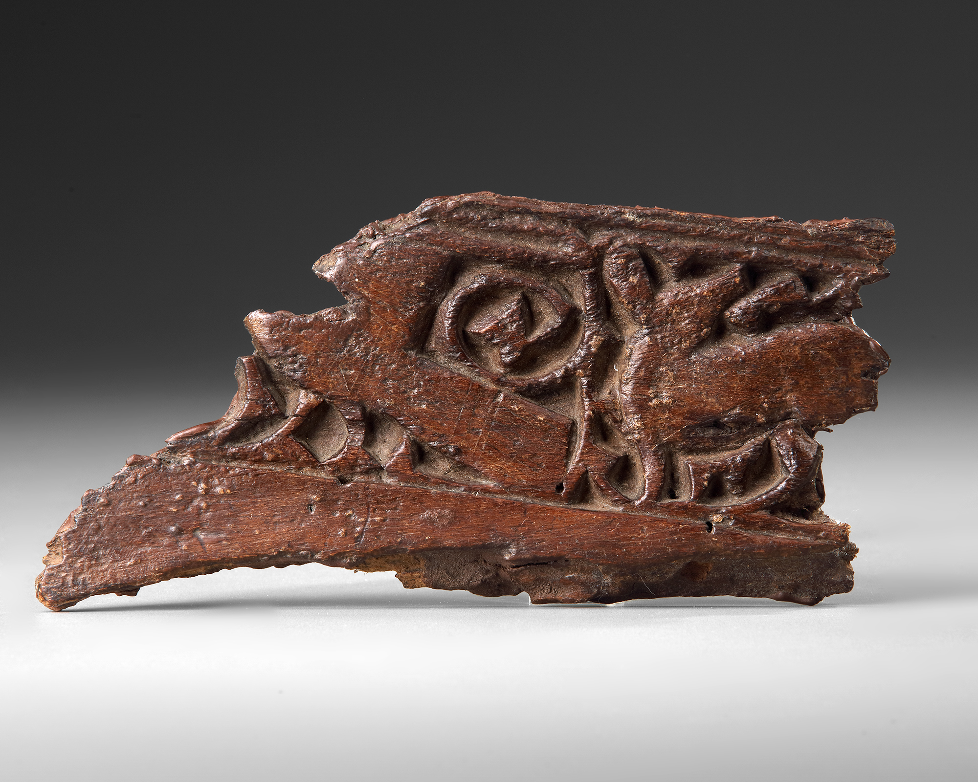 A FATIMID CARVED WOODEN PLAQUE, EGYPT 11TH-12TH CENTURY
