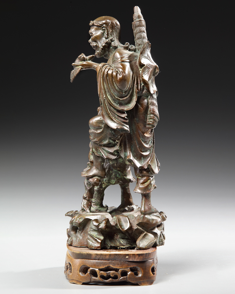 A CHINESE BRONZE FIGURE OF LOHAN WITH A BOY, 19TH CENTURY