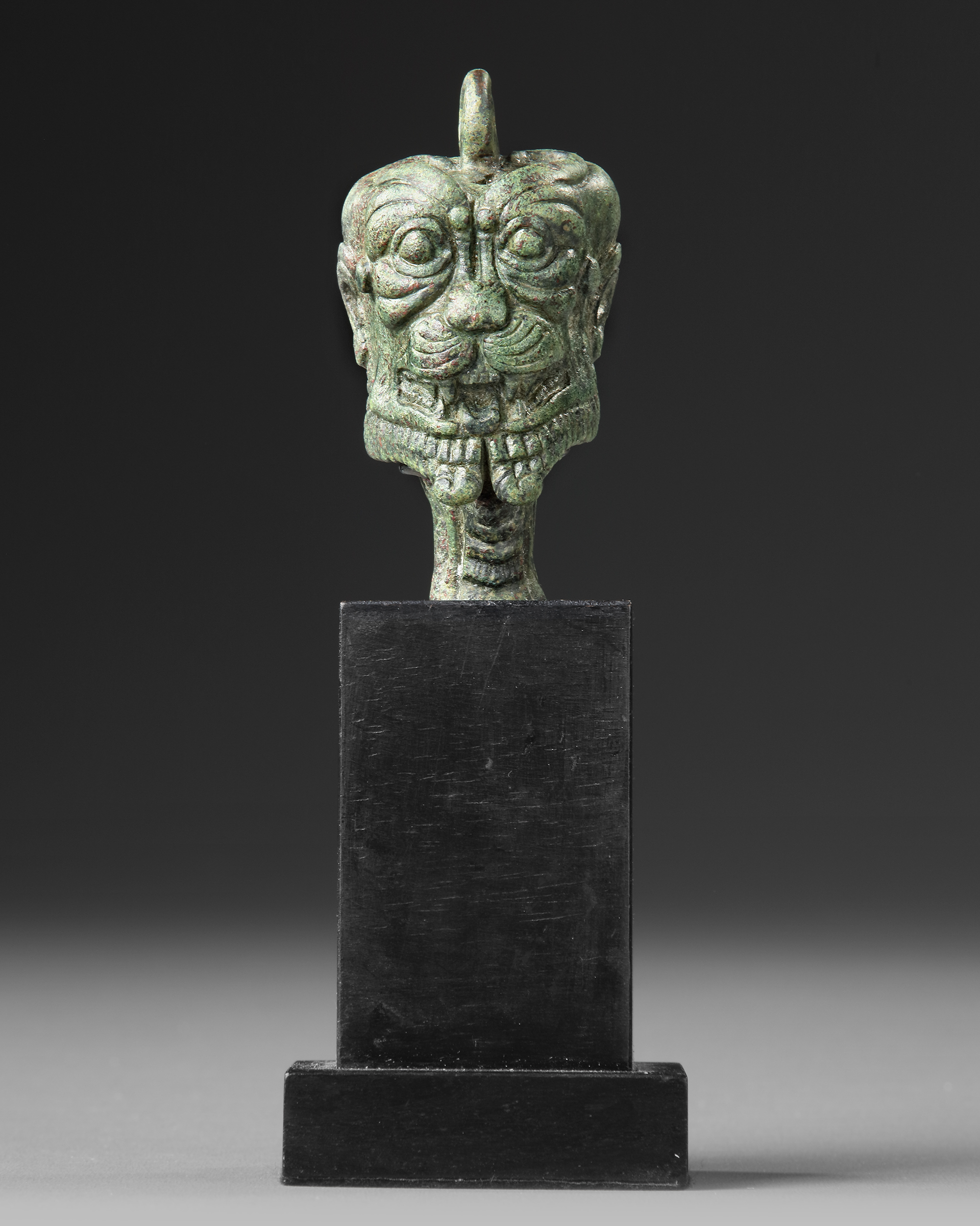 A NEAR EASTERN BRONZE HEAD OF PAZUZU OR DMON , EARLY TO MID 1ST ...