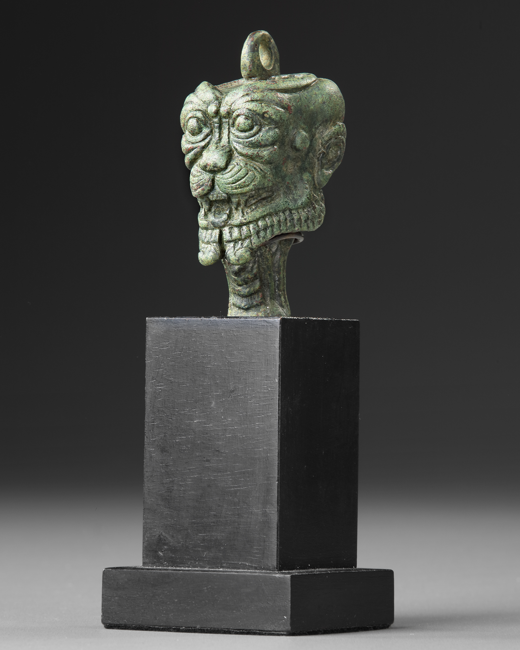 A NEAR EASTERN BRONZE HEAD OF PAZUZU OR DMON , EARLY TO MID 1ST ...