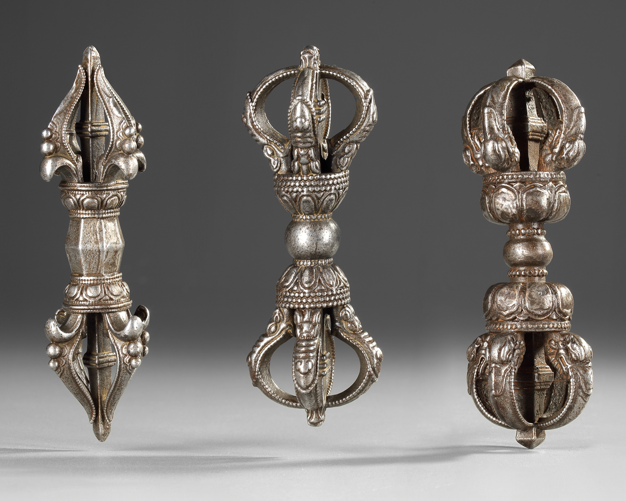 A GROUP OF THREE SINO-TIBETAN BRONZE VAJRAS, 19TH CENTURY