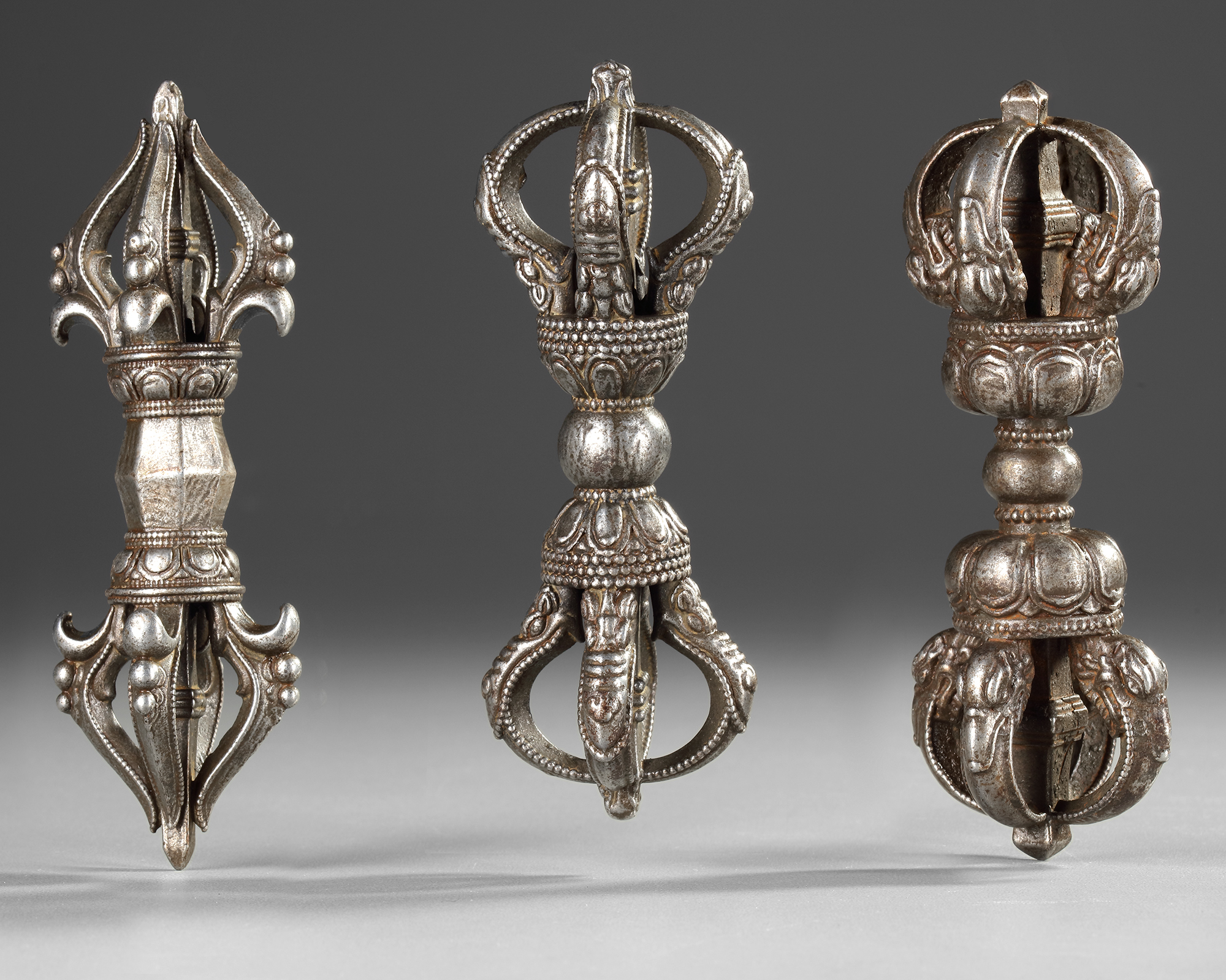A GROUP OF THREE SINO-TIBETAN BRONZE VAJRAS, 19TH CENTURY
