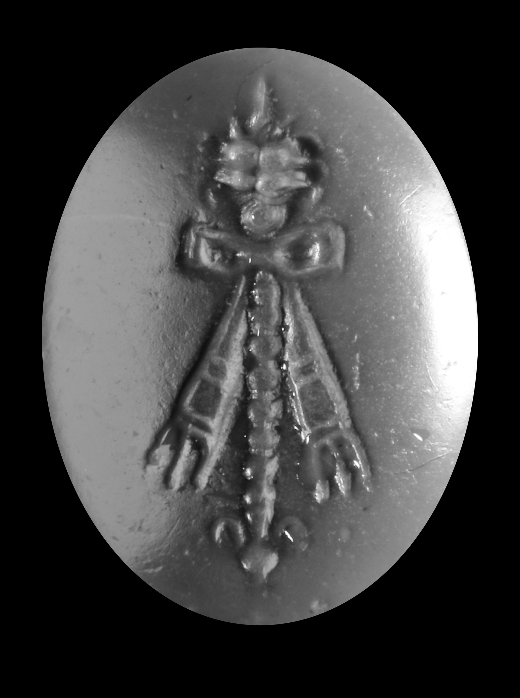 A ROMAN AGATE INTAGLIO SHOWING A THYRSUS, 1ST CENTURY BC-AD