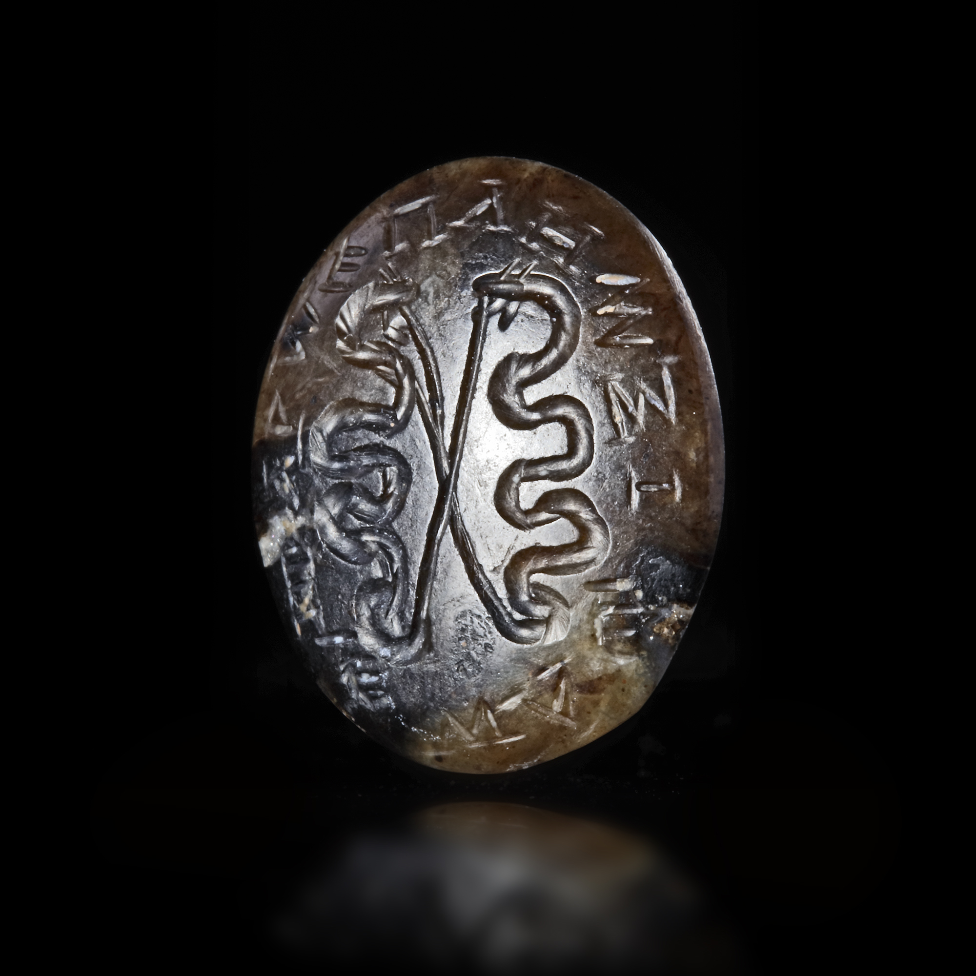 A ROMAN GNOSTIC INTAGLIO IN AGATE, 3RD CENTURY AD