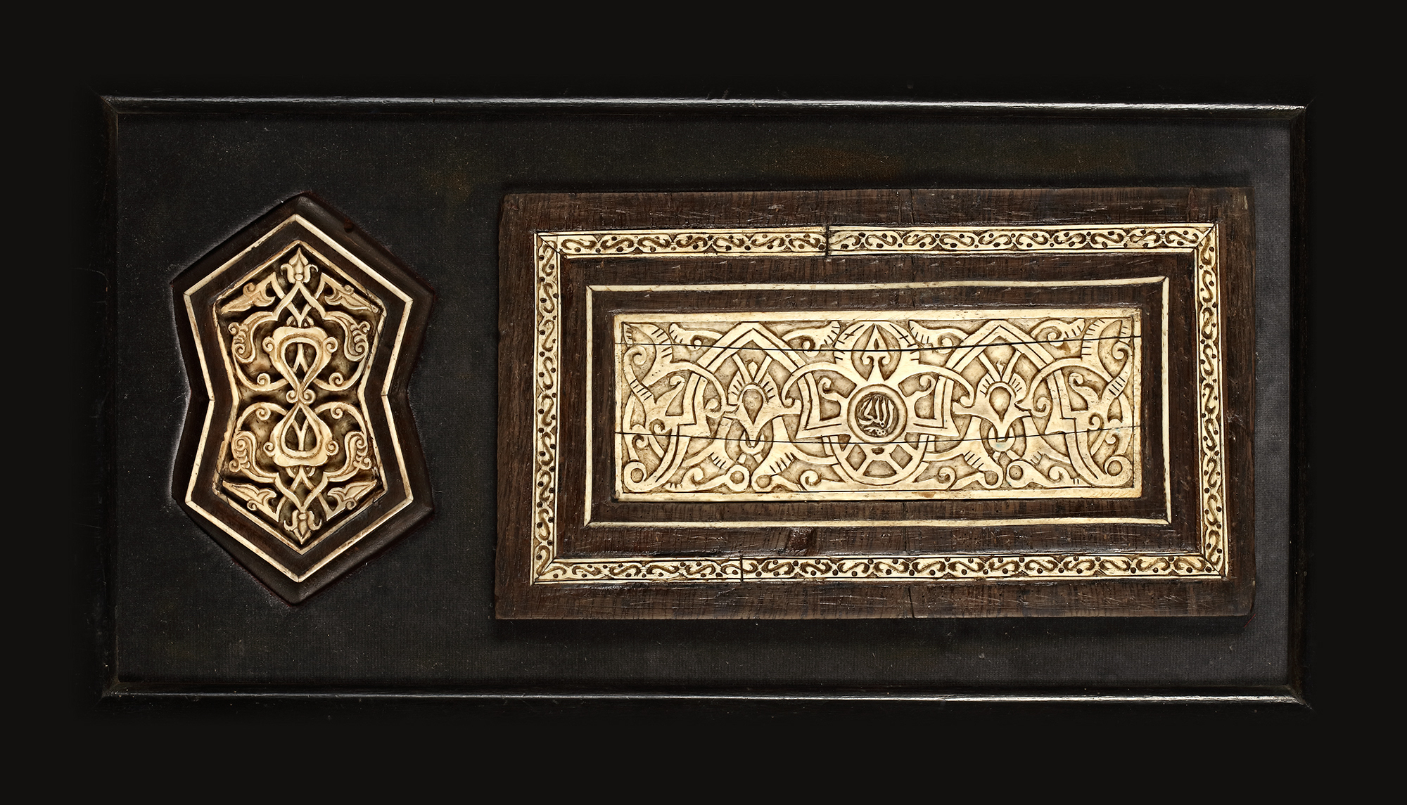 TWO CARVED BONE EBONY-MOUNTED PANELS, 19TH CENTURY