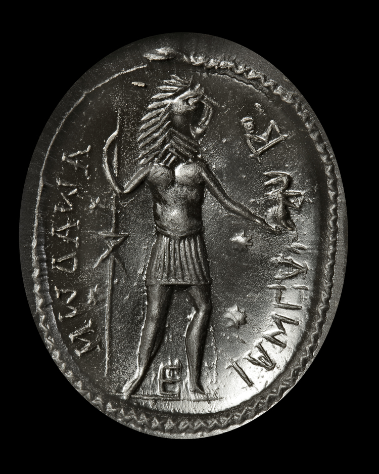 A ROMAN GNOSTIC INTAGLIO IN BRONZE MOUNT, 3RD CENTURY AD