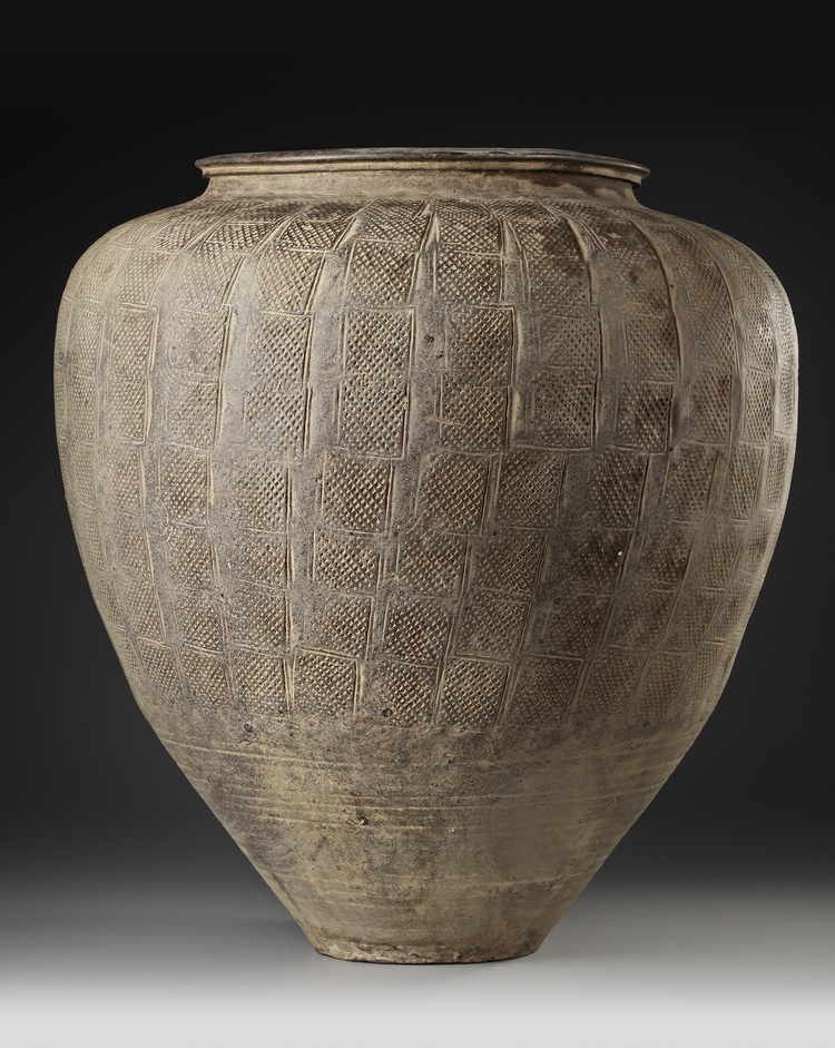 A CHINESE POTTERY JAR WITH IMPRESSED TEXTILE PATTERN, ZHOU DYNASTY ...