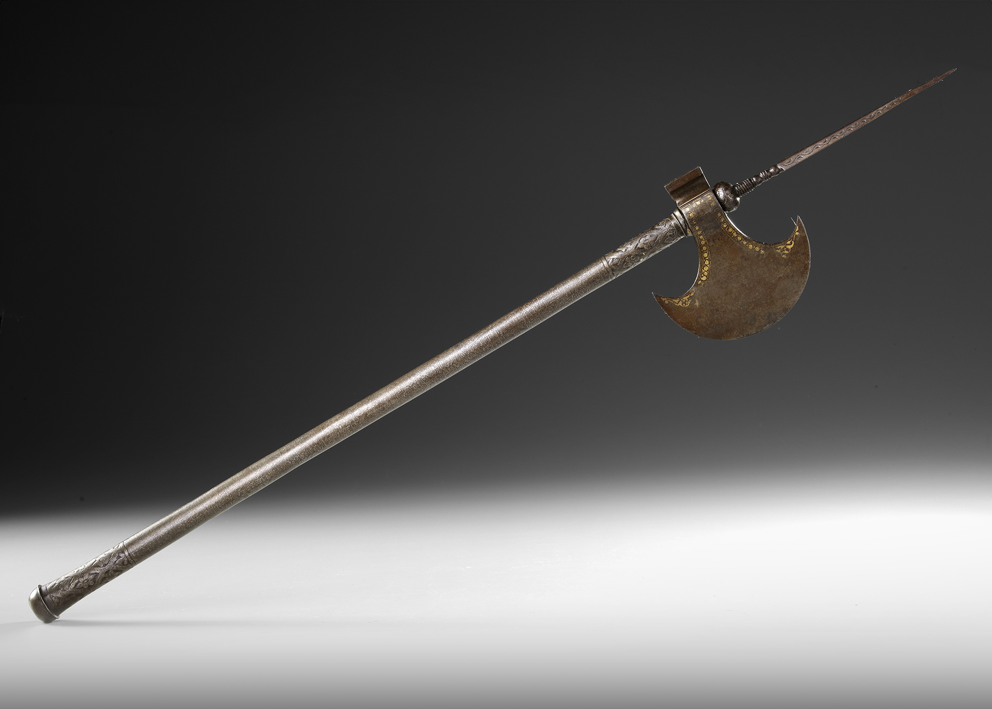 A SAFAVID GOLD-DAMASCENED STEEL AXE, PERSIA, 17TH CENTURY