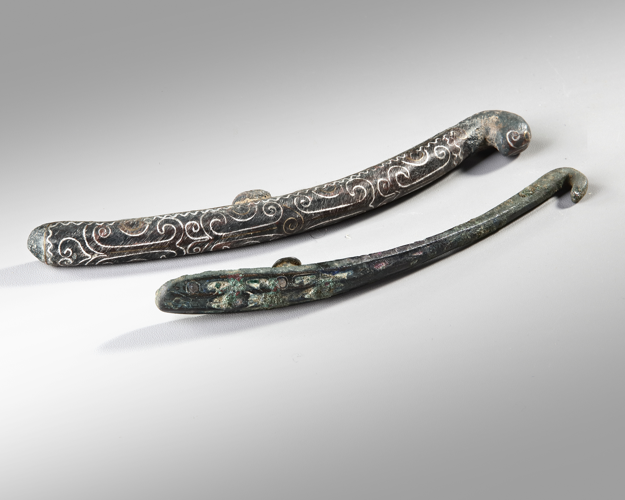 TWO INLAID BRONZE BELT HOOKS, EASTERN ZHOU DYNASTY OR HAN DYANSTY