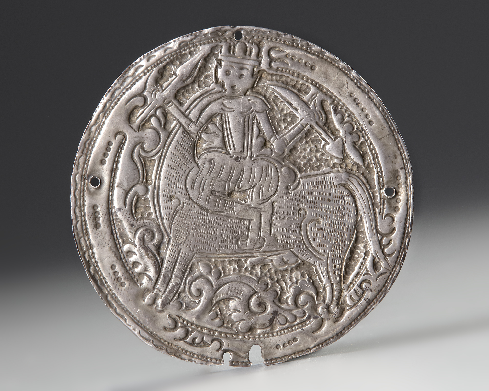 A SILVER SELJUK CIRCULAR PLAQUE, POSSIBLY A MIRROR, 12TH-13TH CENTURY