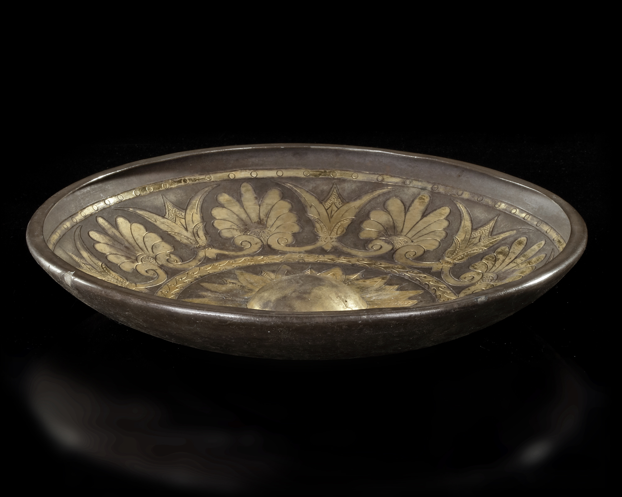 A GREEK SILVER OMPHALE PHIALE WITH GILT DECORATION, 5TH CENTURY BC