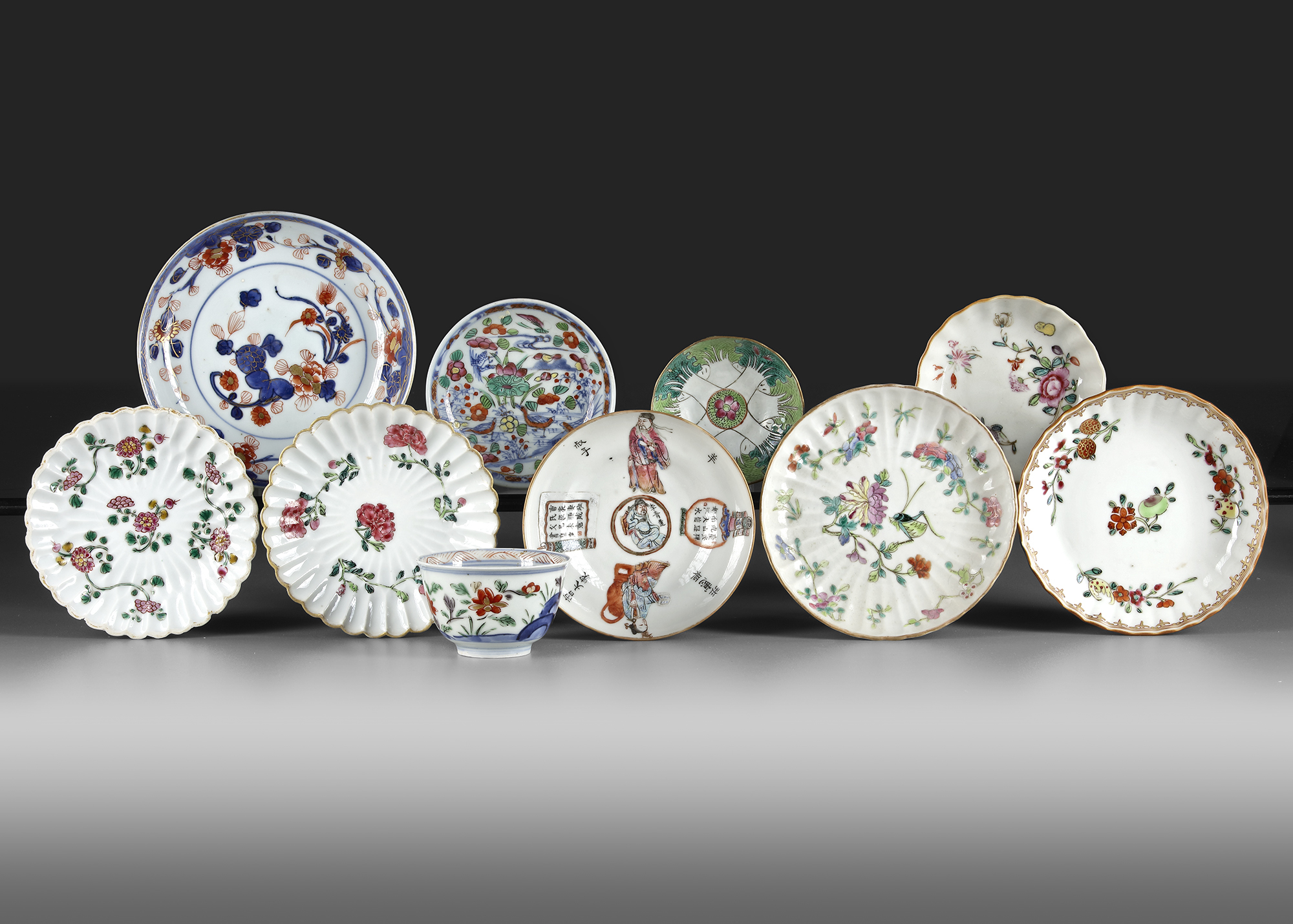 A COLLECTION OF A CUP AND 9 PORCELAIN SAUCERS, 18TH CENTURY AND LATER