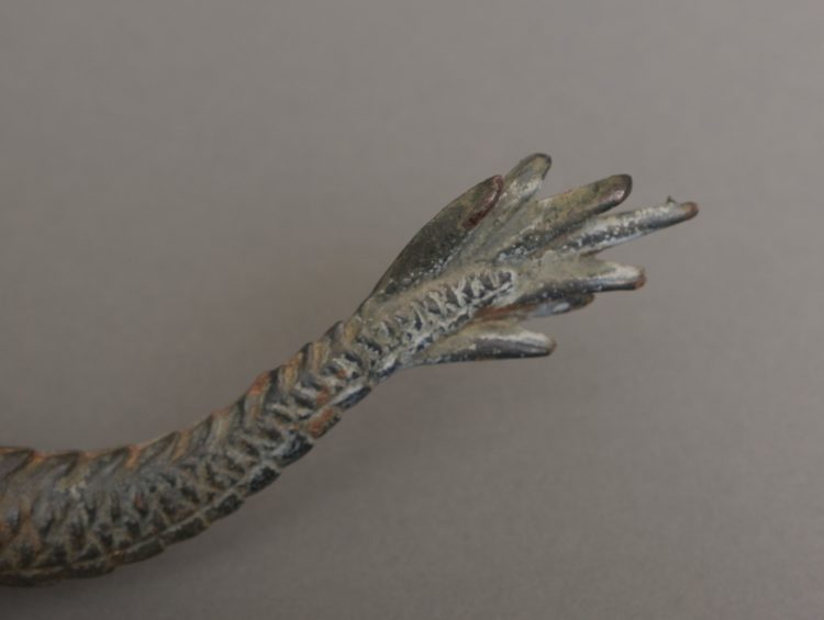 A JAPANESE CAST-IRON OKIMONO DRAGON, MID 20TH CENTURY