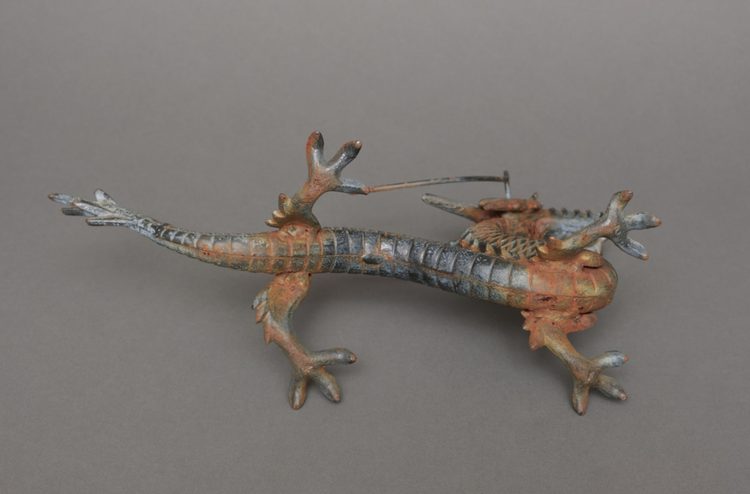 A JAPANESE CAST-IRON OKIMONO DRAGON, MID 20TH CENTURY
