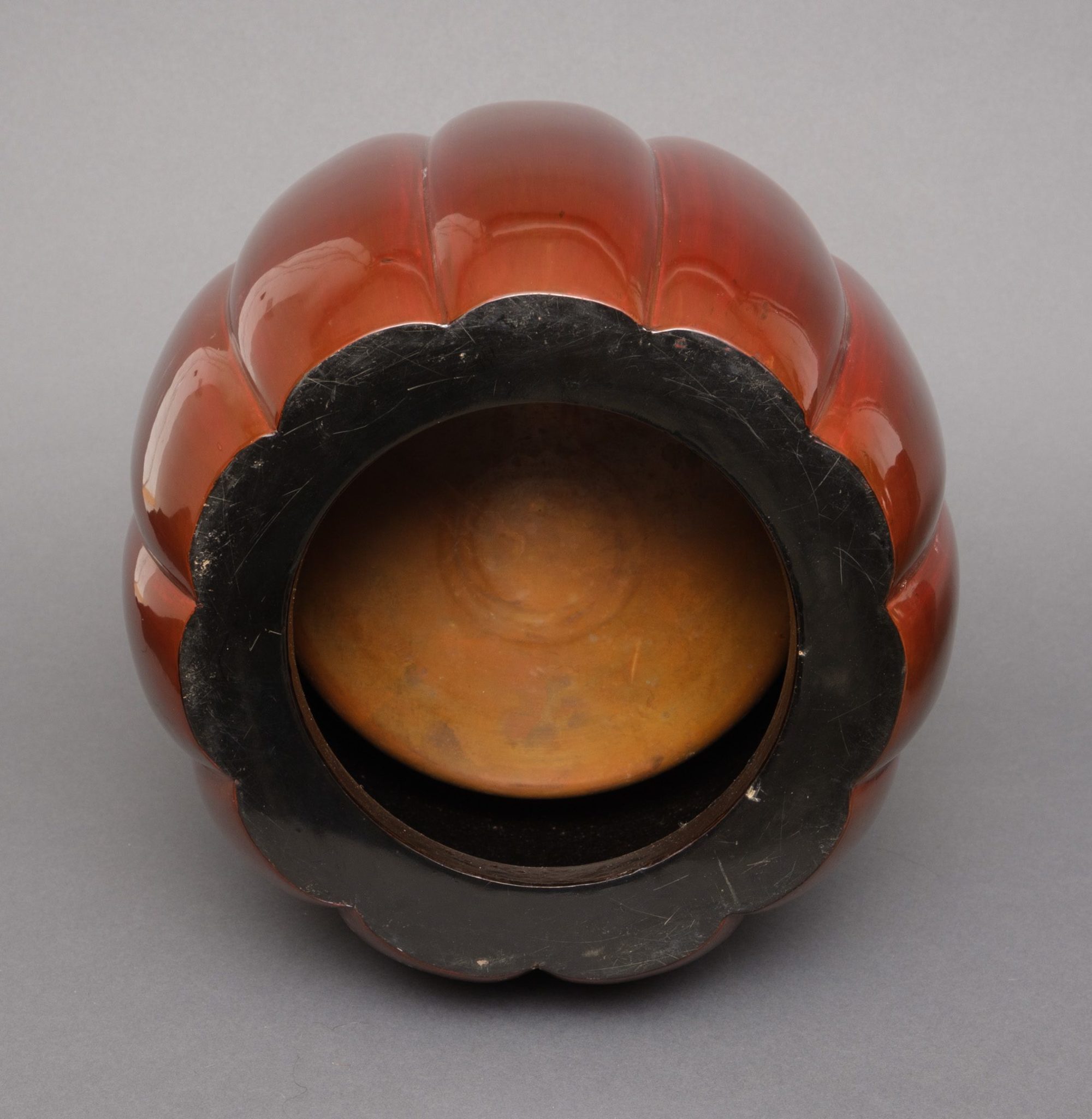 A PAIR OF RED LACQUERED JAPANESE HIBACHI, EARLY SHOWA PERIOD