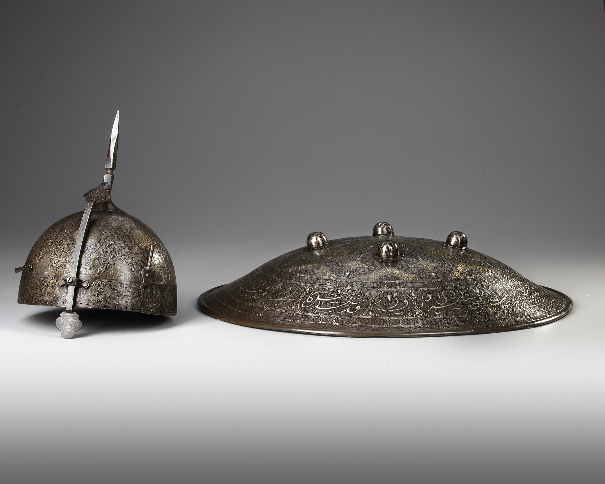 GILT QAJAR WATERED-STEEL HELMET AND SHIELD, PERSIA 19TH CENTURY