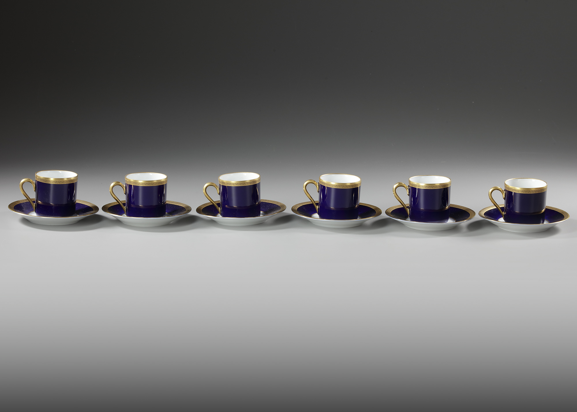 A SET OF SIX LIMOGES PORCELAIN CUPS AND SAUCERS, NAPOLEON III PERIOD ...