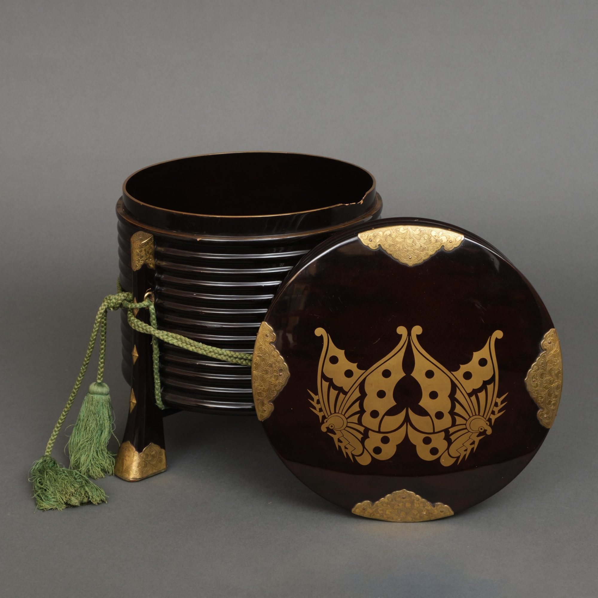 A LACQUERED HOKAI WITH GOLD BUTTERFLY CREST