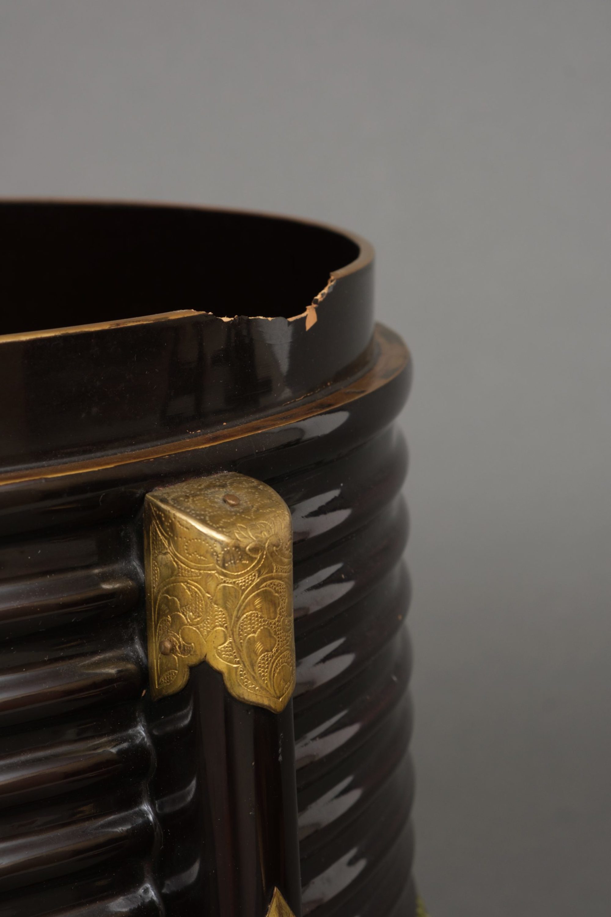 A LACQUERED HOKAI WITH GOLD BUTTERFLY CREST