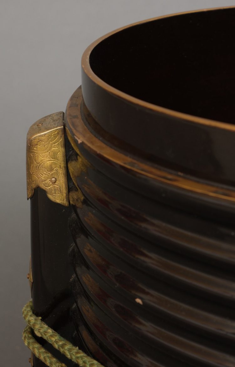 A LACQUERED HOKAI WITH GOLD BUTTERFLY CREST