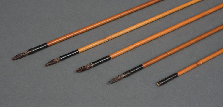 A BLACK LACQUERED QUIVER