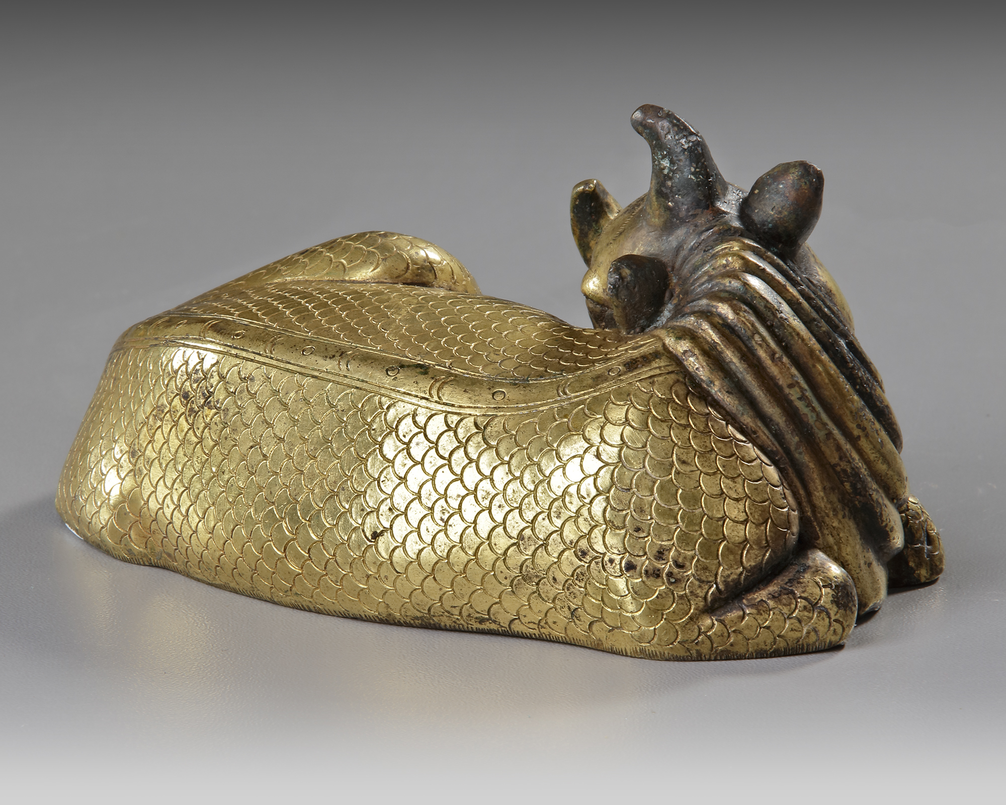 A GILT CHINESE BRONZE 'MYTHICAL BEAST ' WEIGHT, MING DYNASTY OR LATER