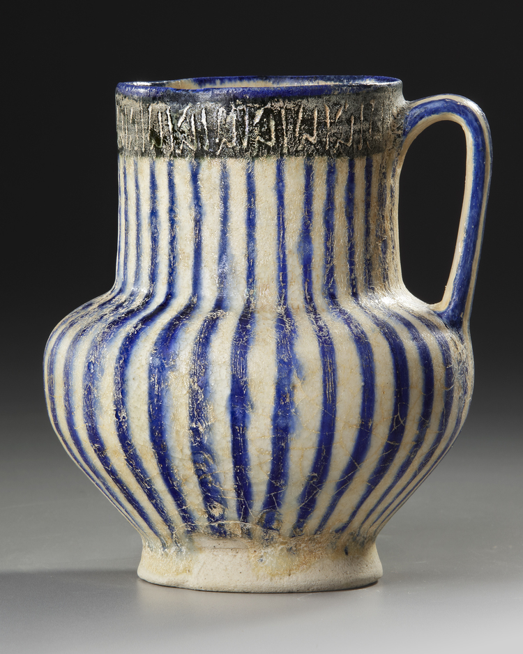 A KASHAN POTTERY JUG, PERSIA, 11TH-12TH CENTURY