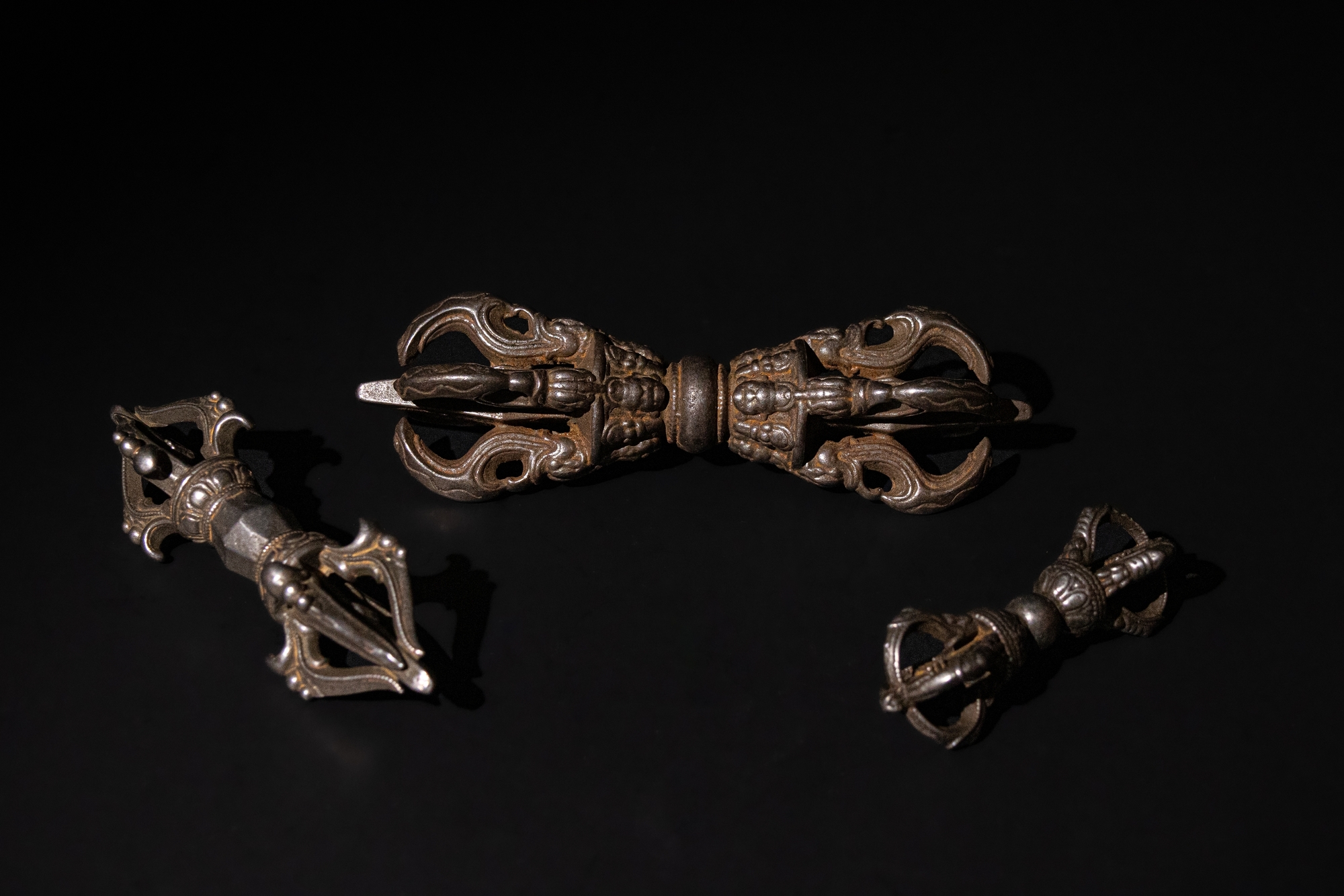 THREE TIBETAN BUDDHIST IRON VAJRAS