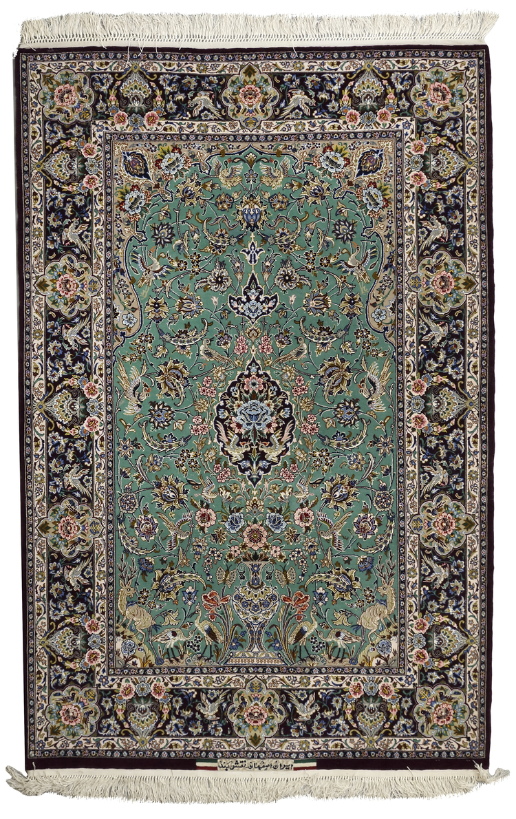 AN EXTREMELY FINE SIGNED ISFAHAN RUG WITH SILK
