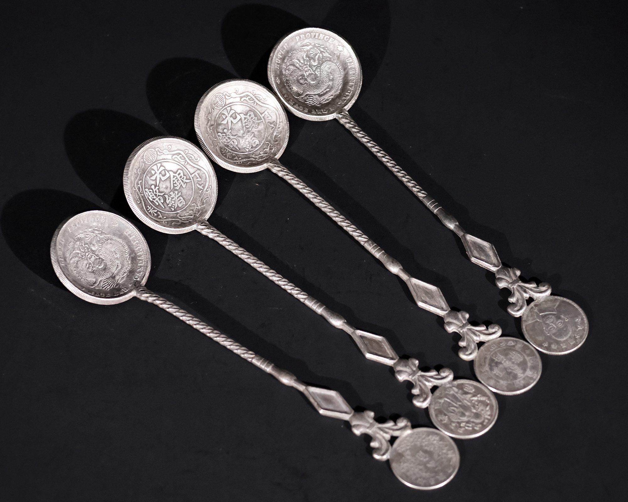 FOUR CHINESE COIN SPOONS, 20TH CENTURY