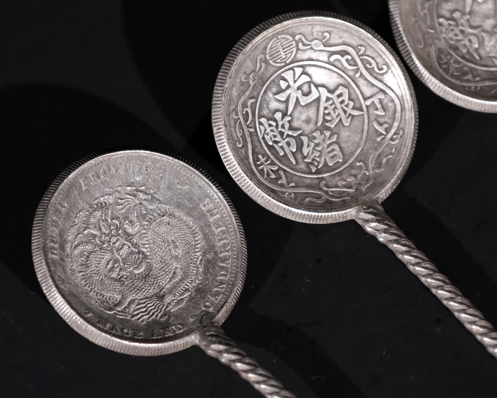 FOUR CHINESE COIN SPOONS, 20TH CENTURY