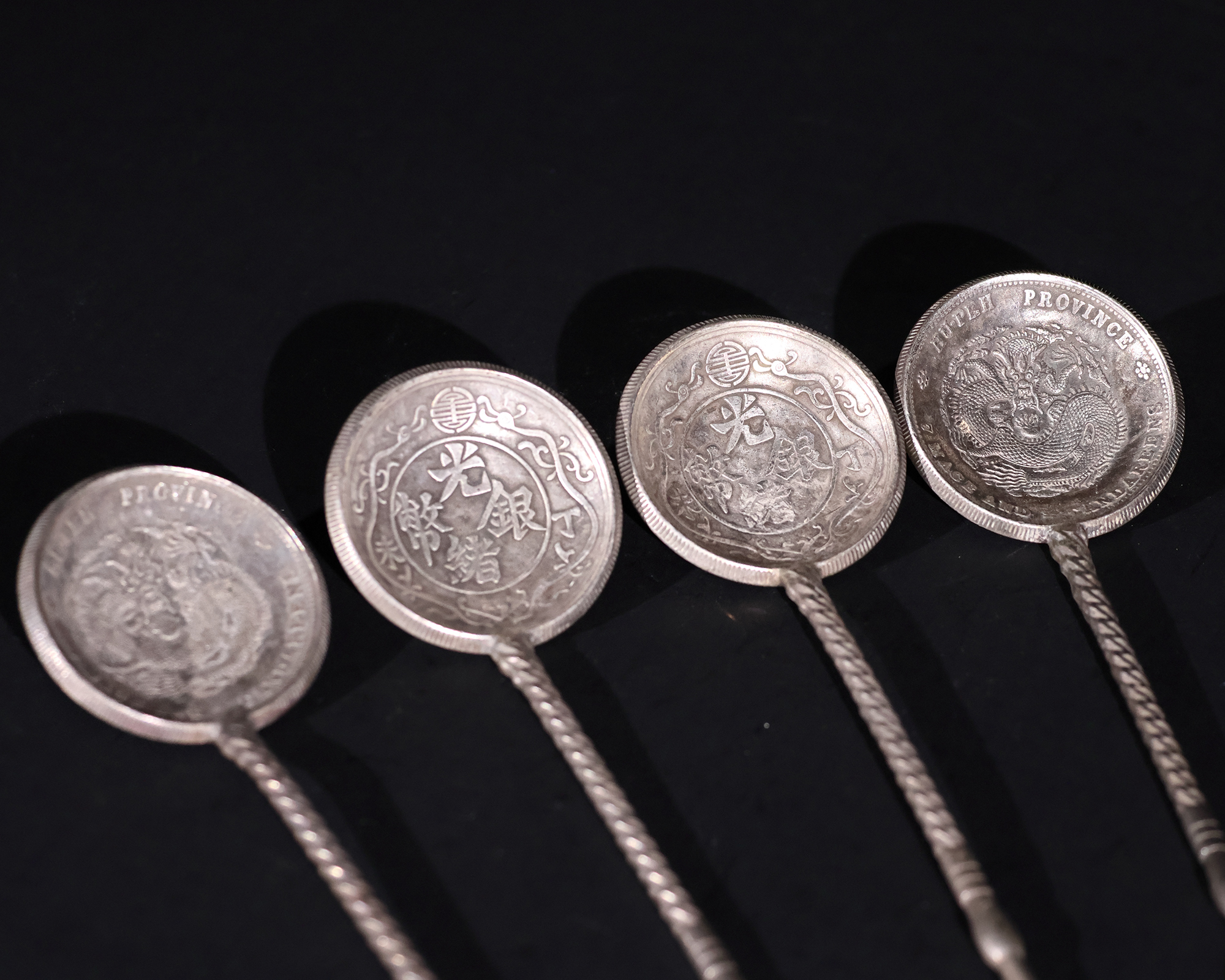 FOUR CHINESE COIN SPOONS, 20TH CENTURY